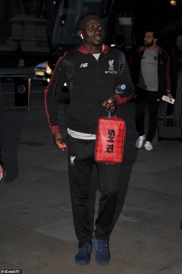 Liverpool players arrive at Lime Street station ahead of Arsenal clash ...
